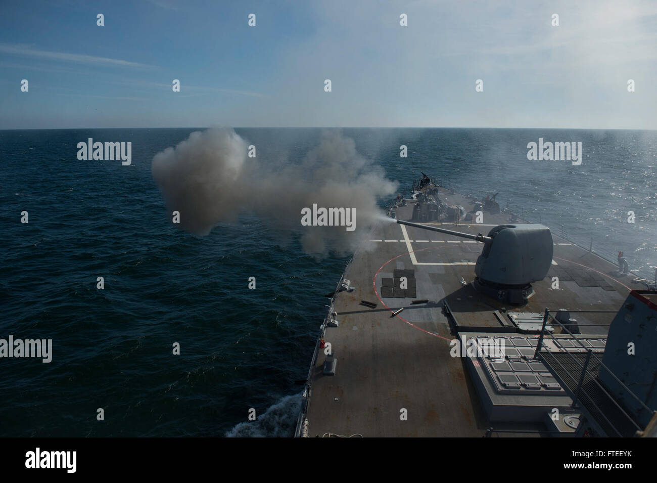 A 5-inch gun fires aboard the USS Oscar Austin (DDG 79) during the 2014 ...