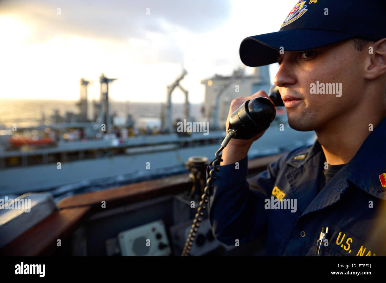 Ensign Heriberto Cruz stands watch on the bridge wing of the USS Nitze ...