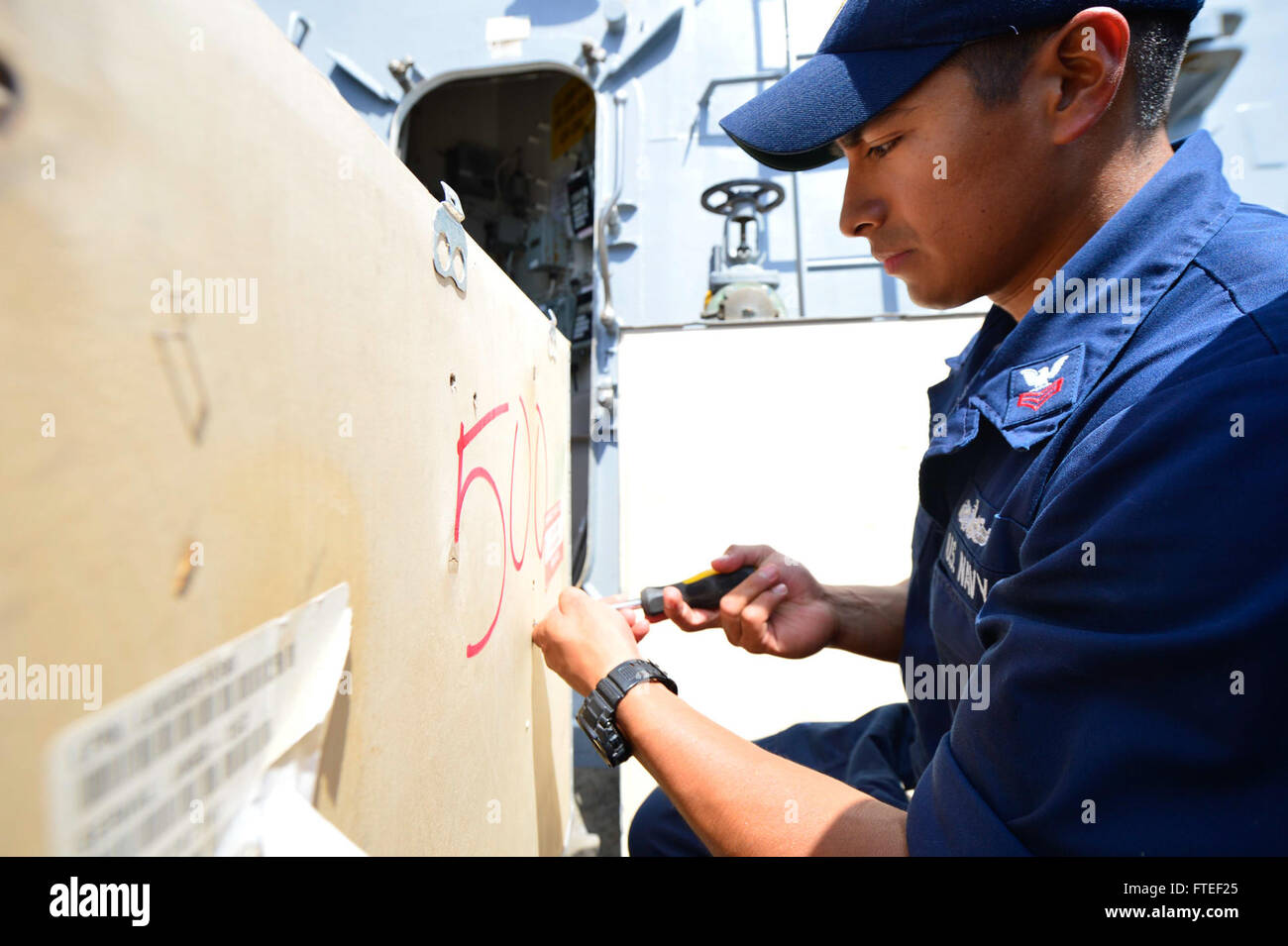 A U.S. Navy photograph of Fire Controlman 1st Class Roger Bailey aboard ...