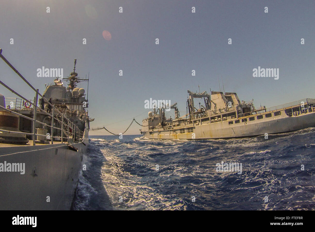 The USS Vella Gulf (CG 72) conducts an underway replenishment with the ...