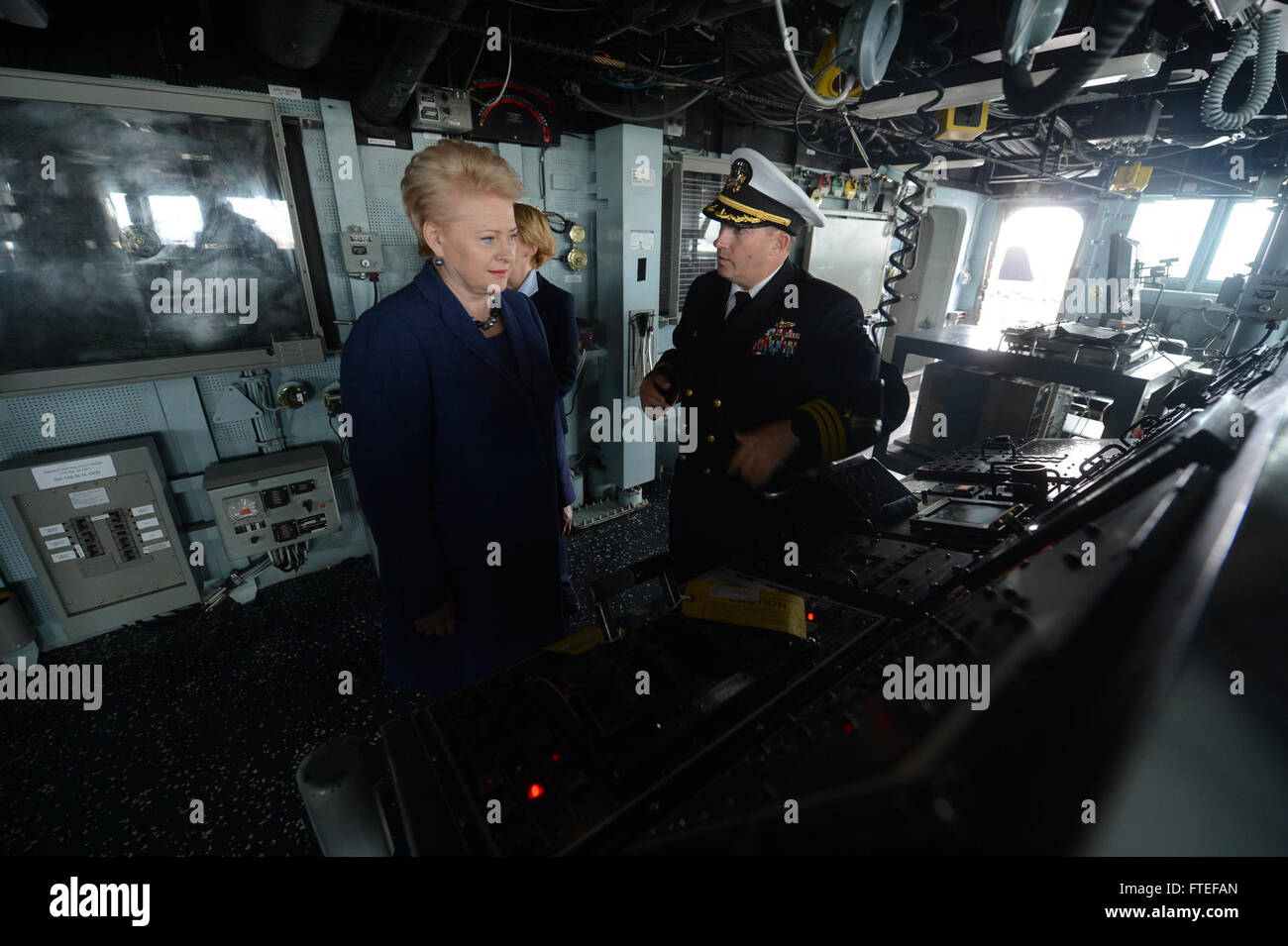 Commander Brian Diebold of USS *Oscar Austin* (DDG 79) gives a tour to ...