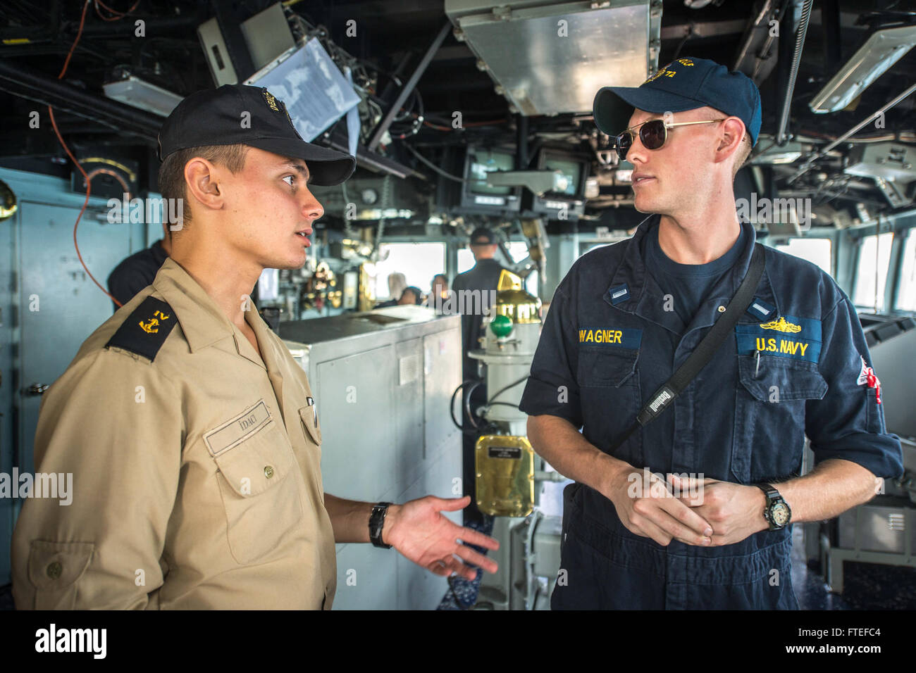 This U.S. Navy photograph captures Lt. j.g. Matthew Wagner speaking ...