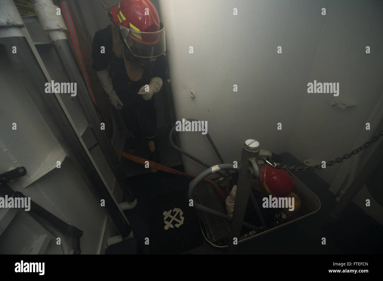 Sailors aboard the USS Oscar Austin (DDG 79) conduct a firefighting ...