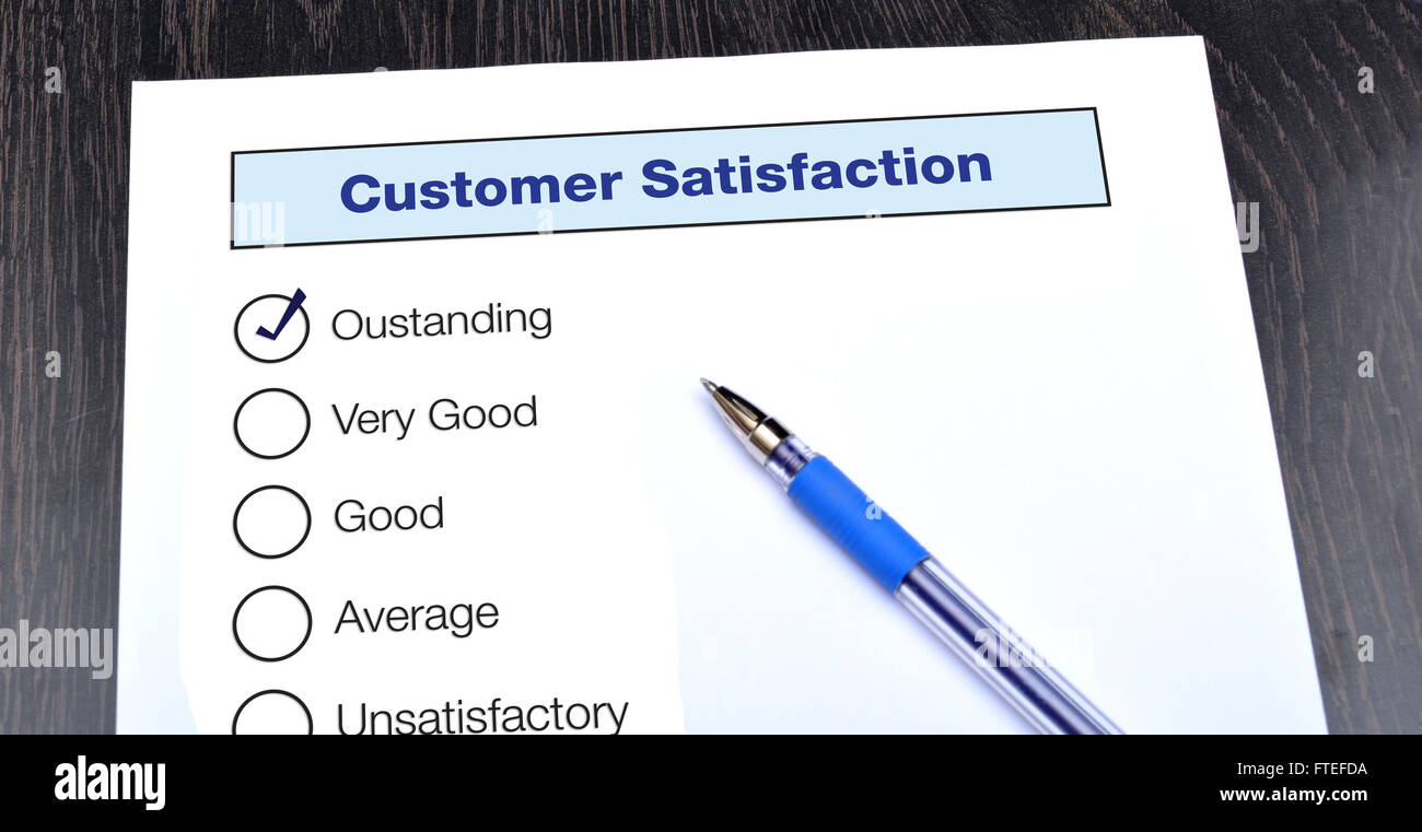 Customer Satisfaction Form with Outstanding checked Stock Photo - Alamy