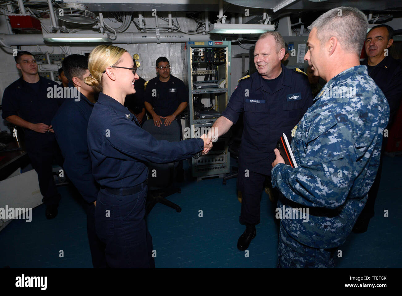 Rear Adm. Lars Saunes of the Royal Norwegian Navy congratulates IT2 ...