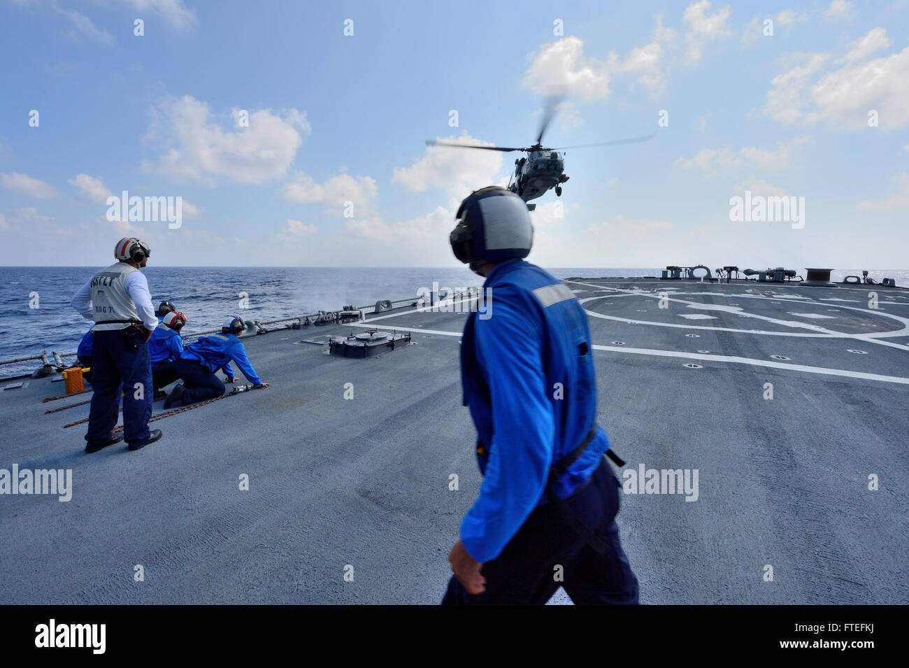 This image captures sailors aboard the USS Ross (DDG 71) on the flight ...