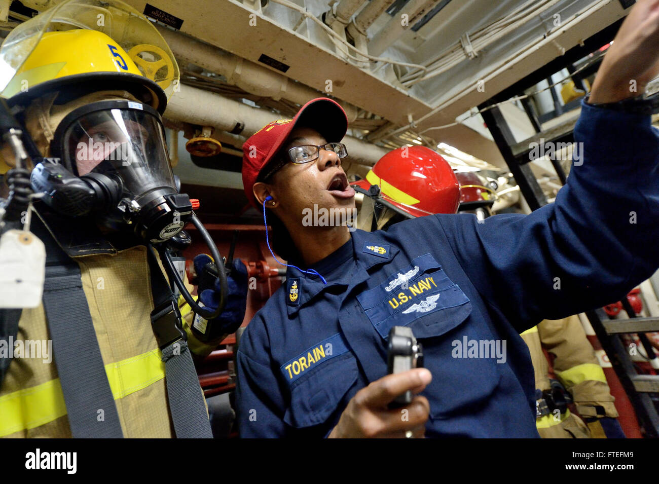 During a general quarters drill aboard the USS Ross (DDG 71), Senior ...