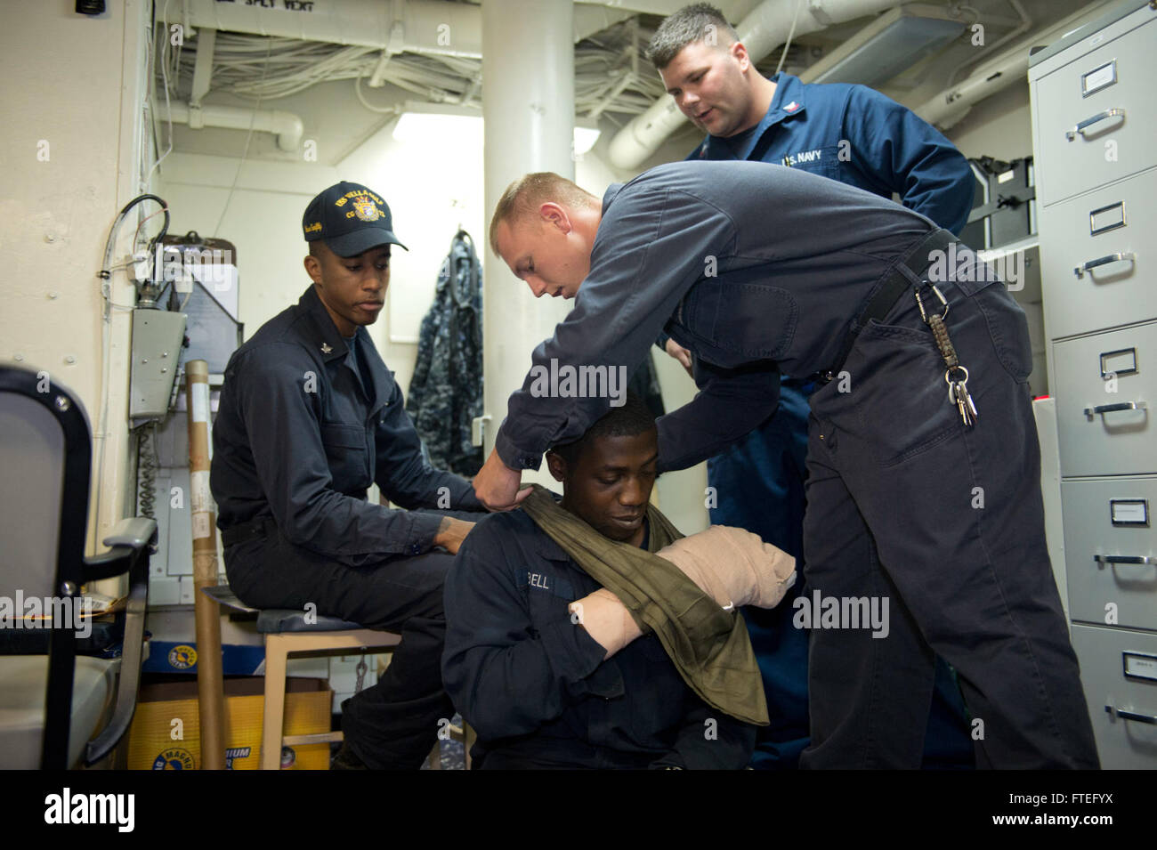 Hospital Corpsman 3rd Class Lucas Hostettler inspects a simulated wound ...