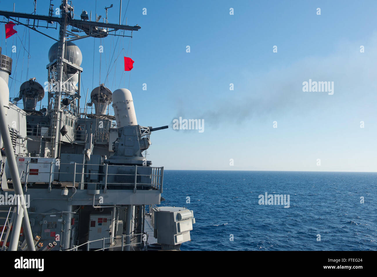 This photo shows the Close-In Weapons System (CIWS) in action aboard ...