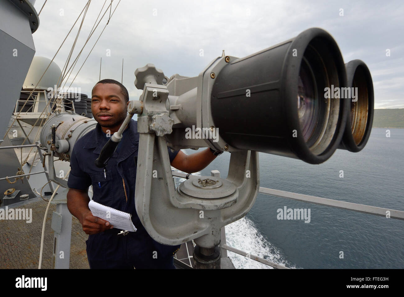 Intelligence Specialist Seaman Ronald Freeman observes outbound ...