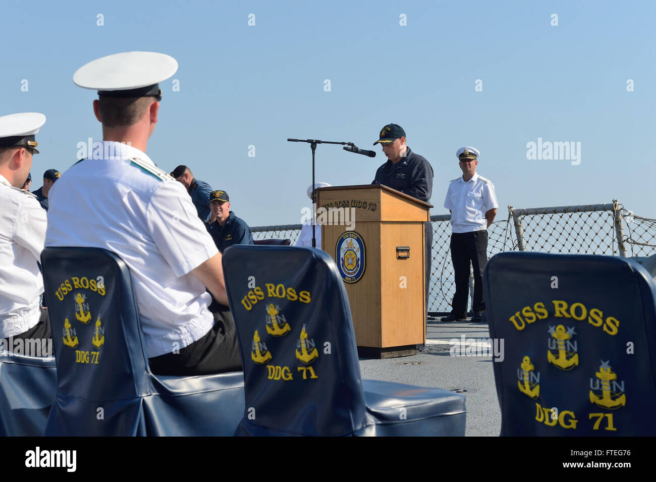 A U.S. Navy commander addresses his crew during the closing ceremony of ...