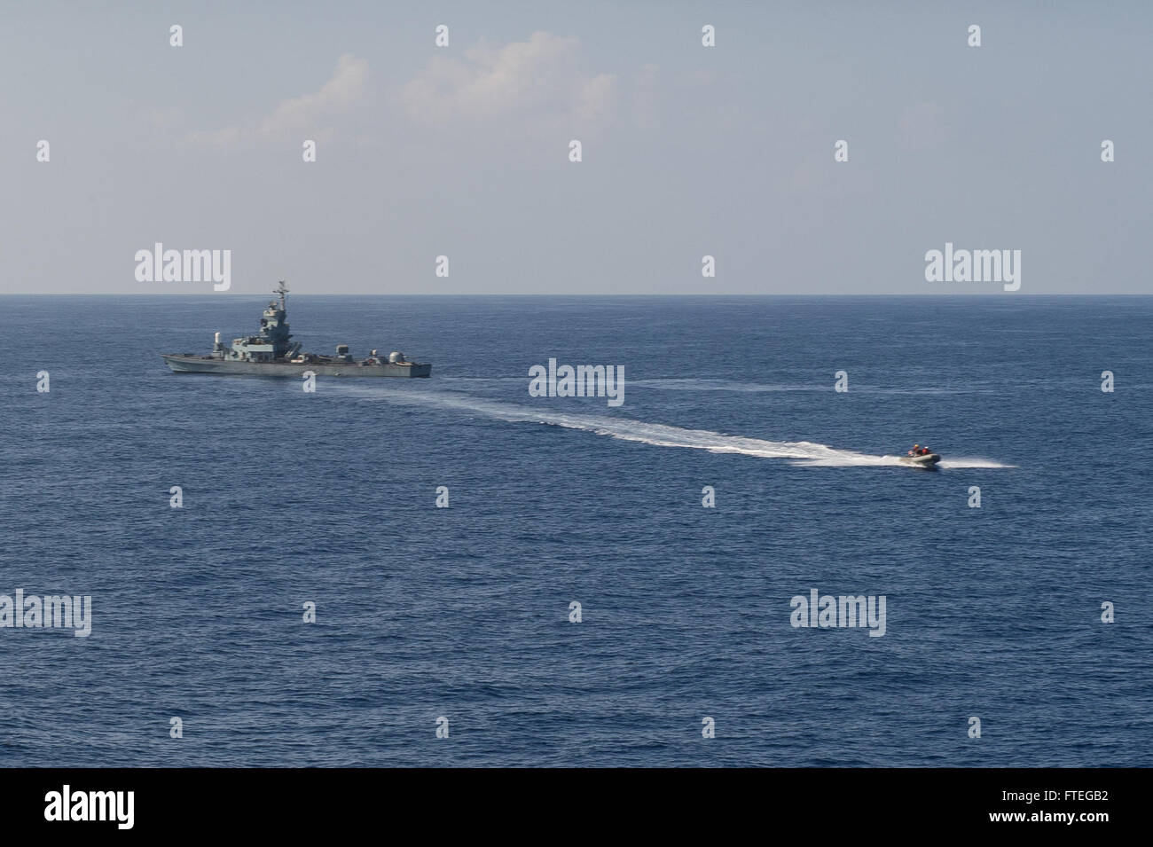 A ridged-hull inflatable boat from the USS Cole (DDG 67) performs ...