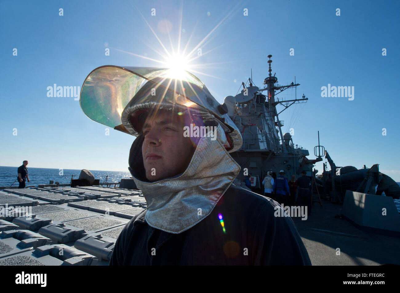 A U.S. Navy Damage Controlman prepares to combat a simulated aircraft ...