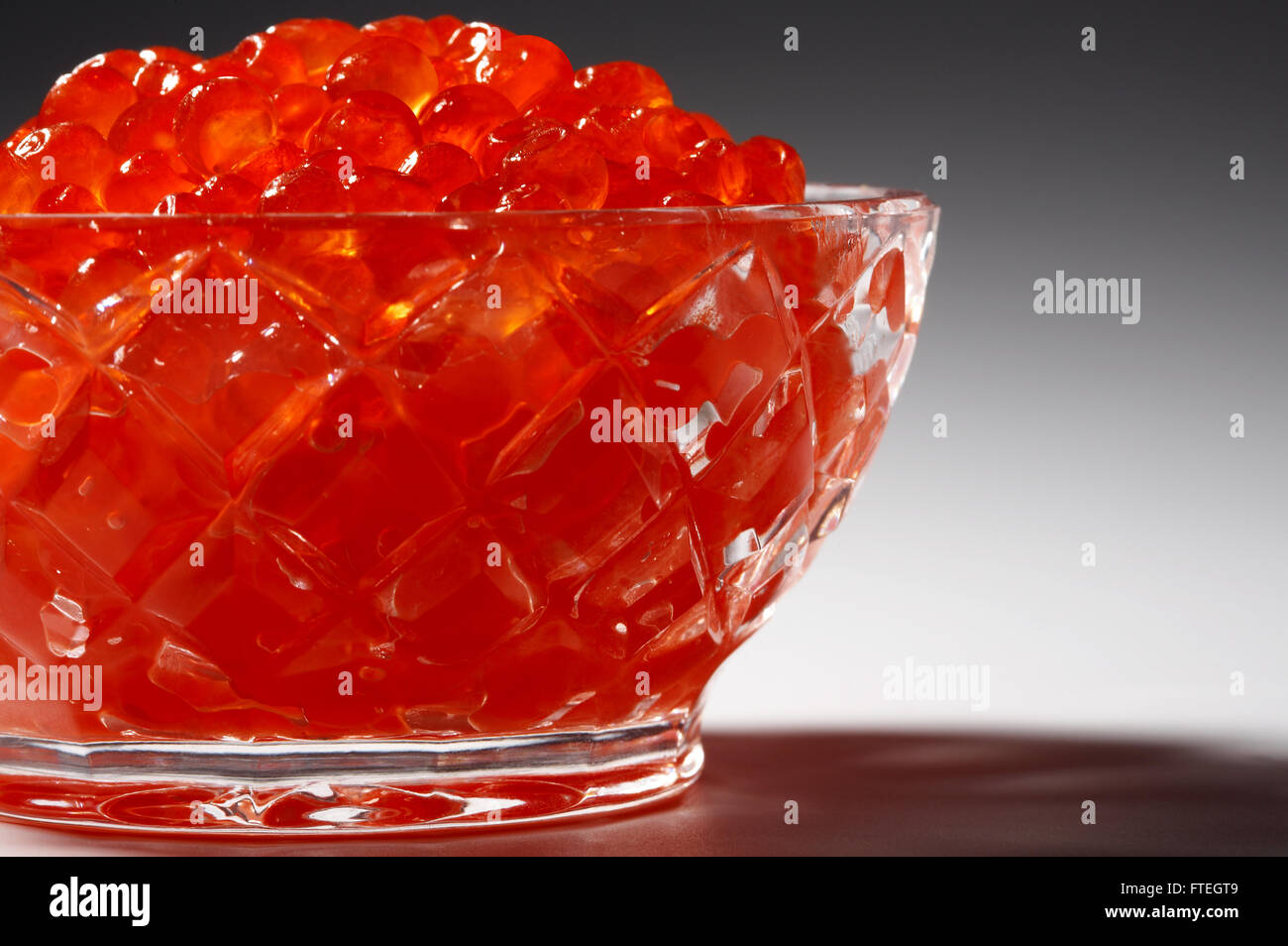 Fresh red caviar in beautiful crystal utensils Stock Photo - Alamy