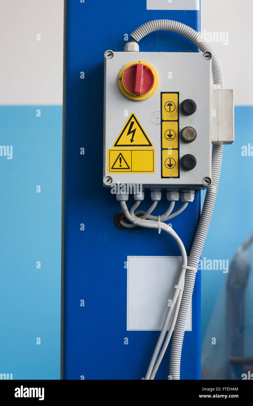 Control panel of the lift in car-care center Stock Photo - Alamy