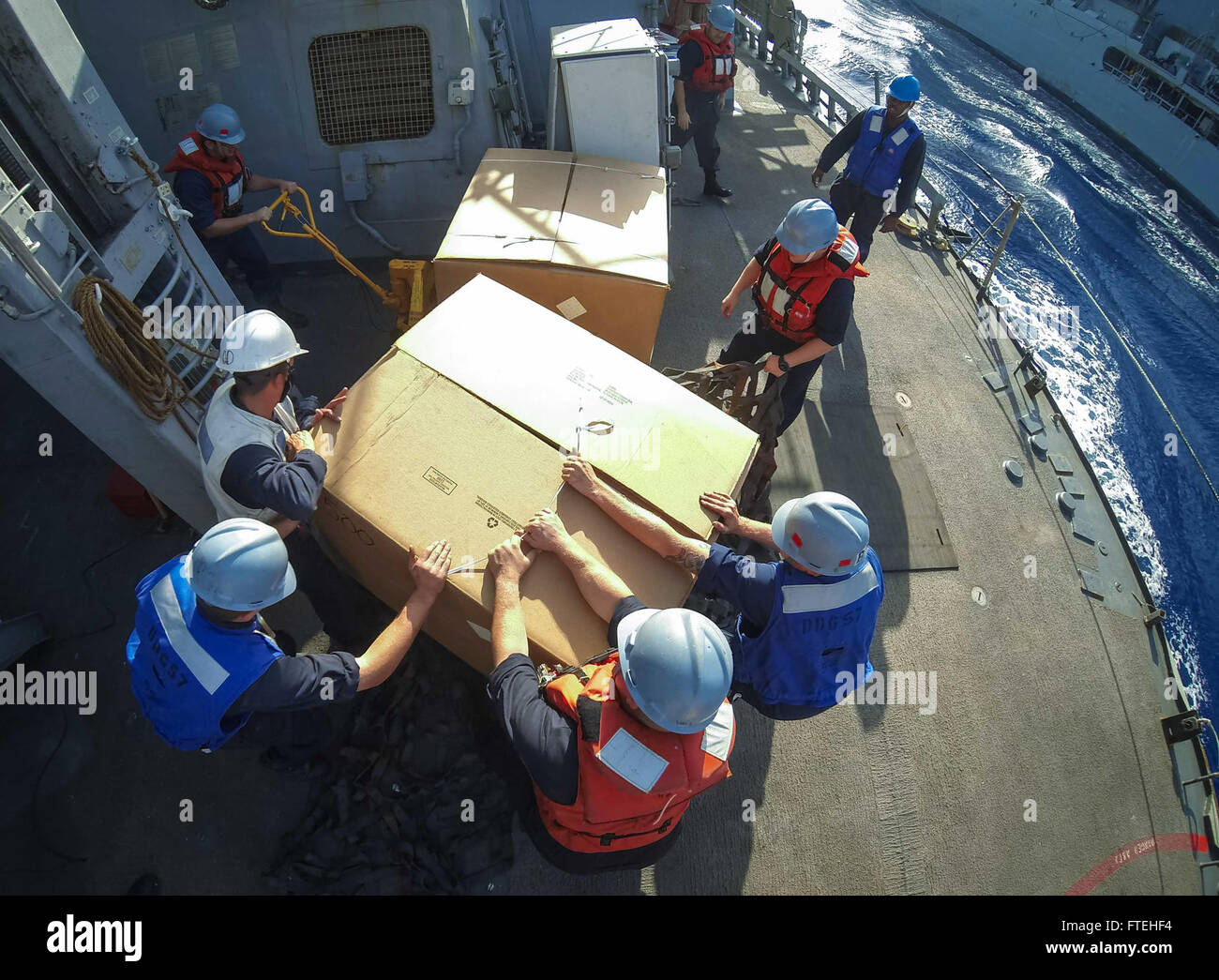 This image shows sailors aboard the USS Mitscher (DDG 57) during an ...