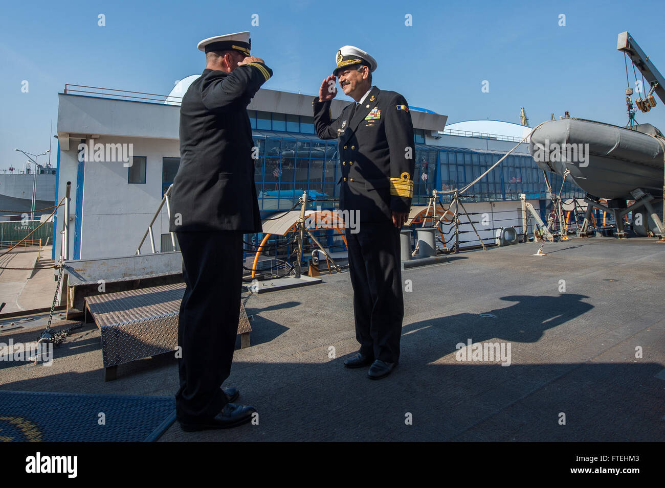 Cmdr. Dennis Farrell, commanding officer of the USS Cole (DDG 67), and ...