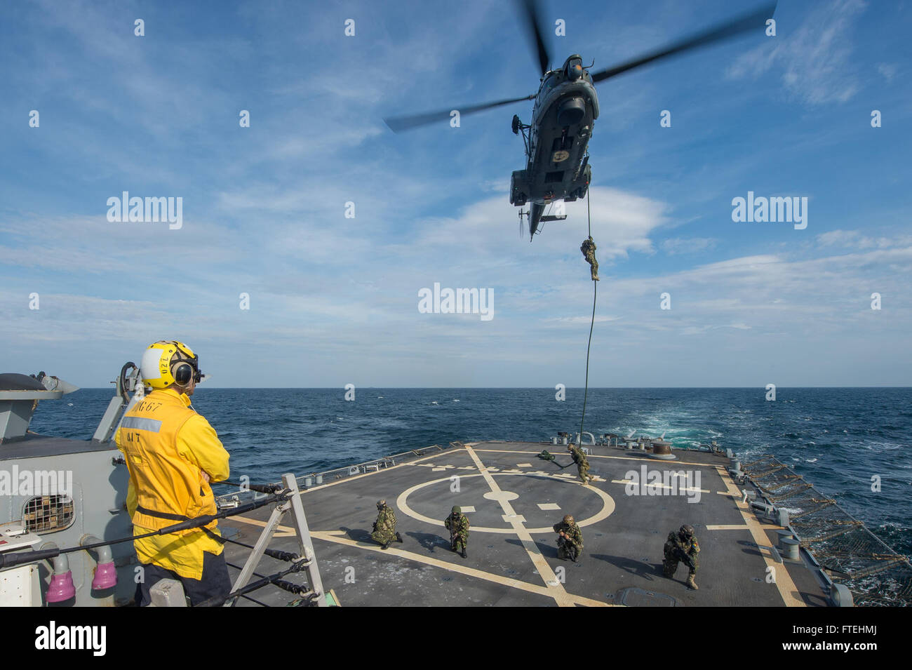 Romanian Navy special forces perform a fast rope insertion on the USS ...