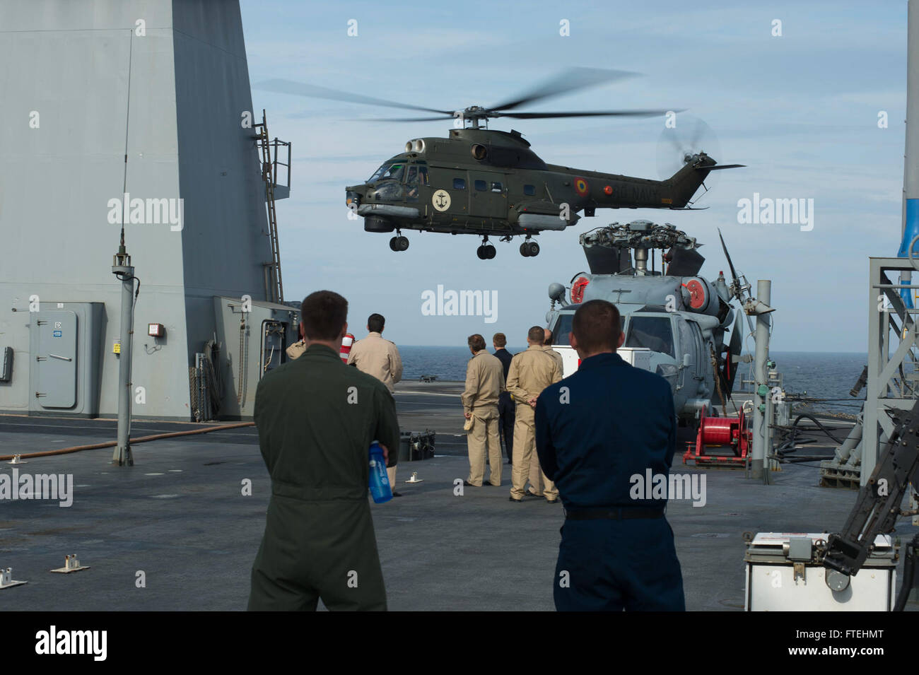 This image captures a Romanian Navy IAR-330 helicopter performing ...