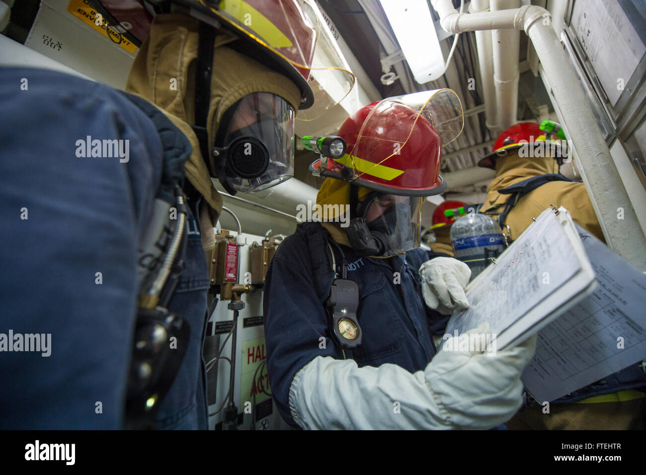 Engineman 2nd Class Daniel Elliott inspects electrical systems aboard ...