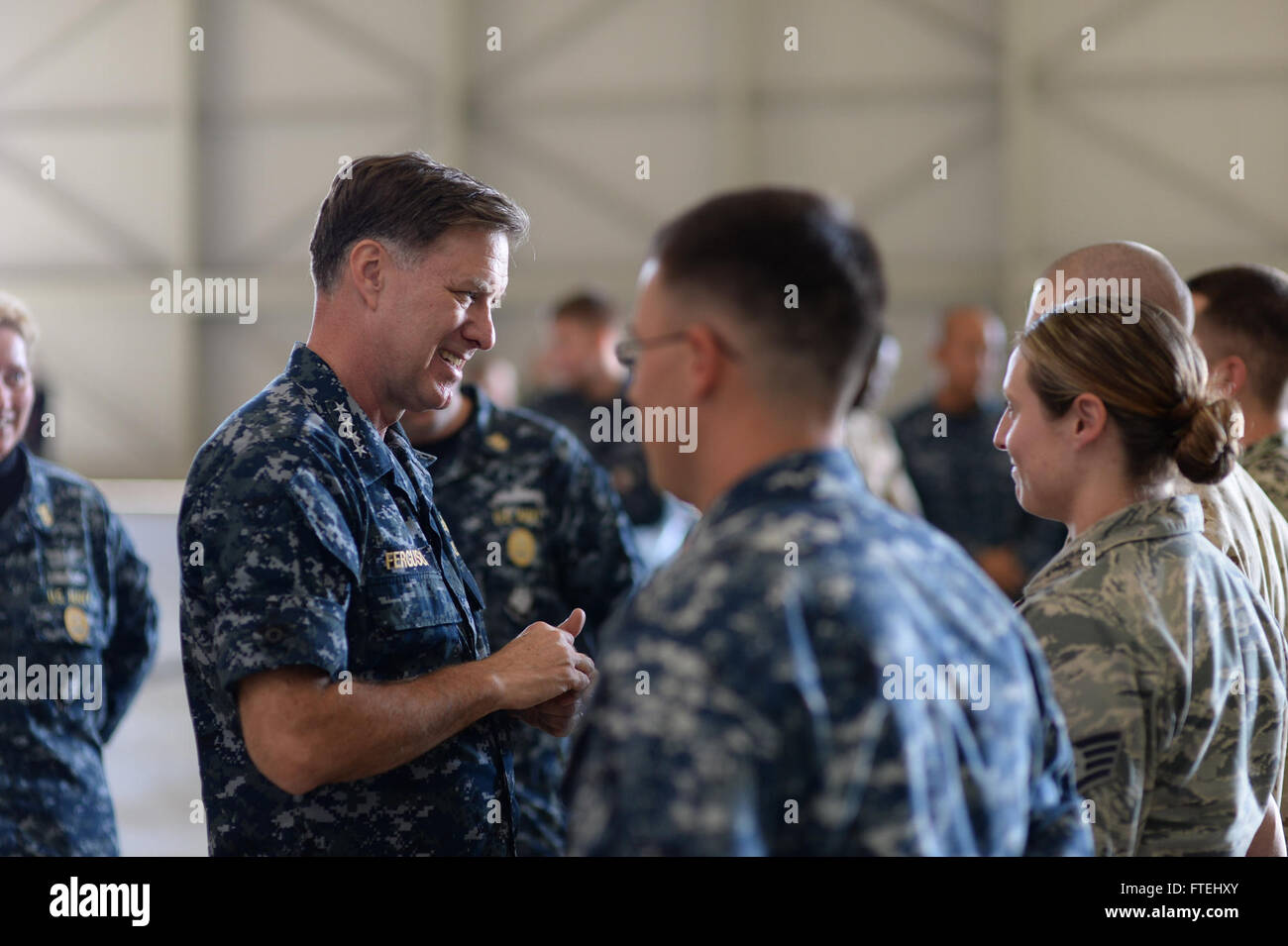 Adm. Mark Ferguson, commander of U.S. Naval Forces Europe-Africa, addresses Airmen during an all ...