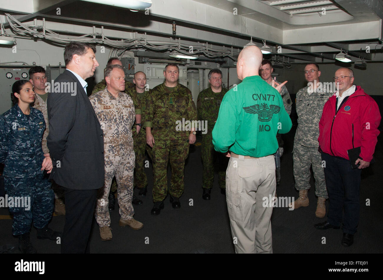 Commander Grady Duffey, aboard the USS George H.W. Bush (CVN 77), gives ...