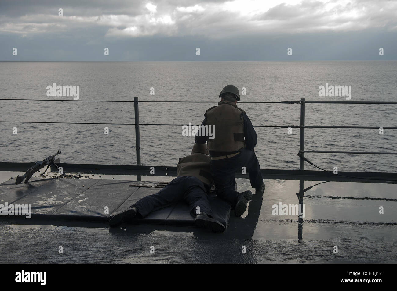 A photo showing U.S. Navy personnel, Chief Gunners Mate Harry Kindt and ...