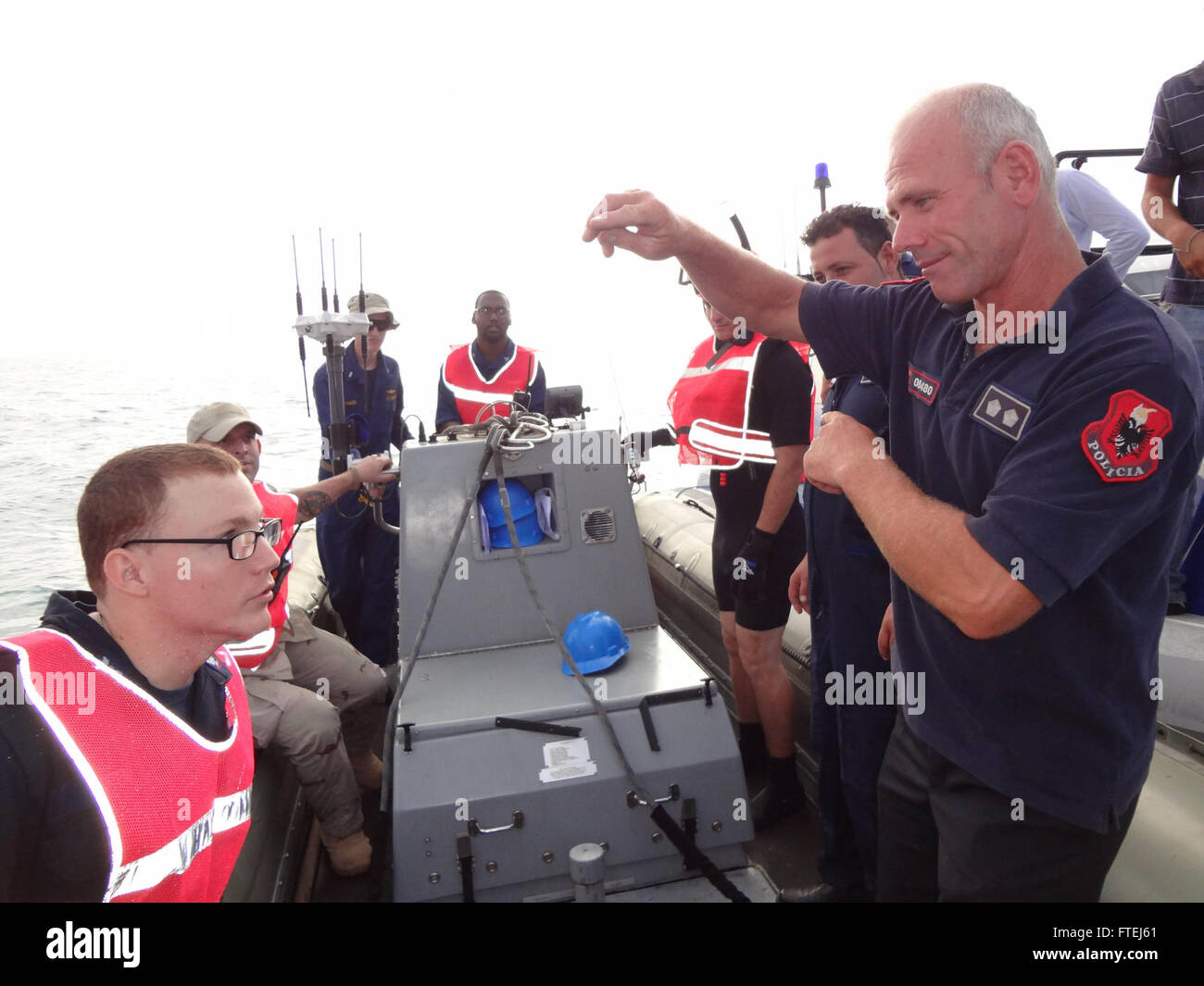 This image shows Engineman 3rd Class Corey Linton aboard the guided ...
