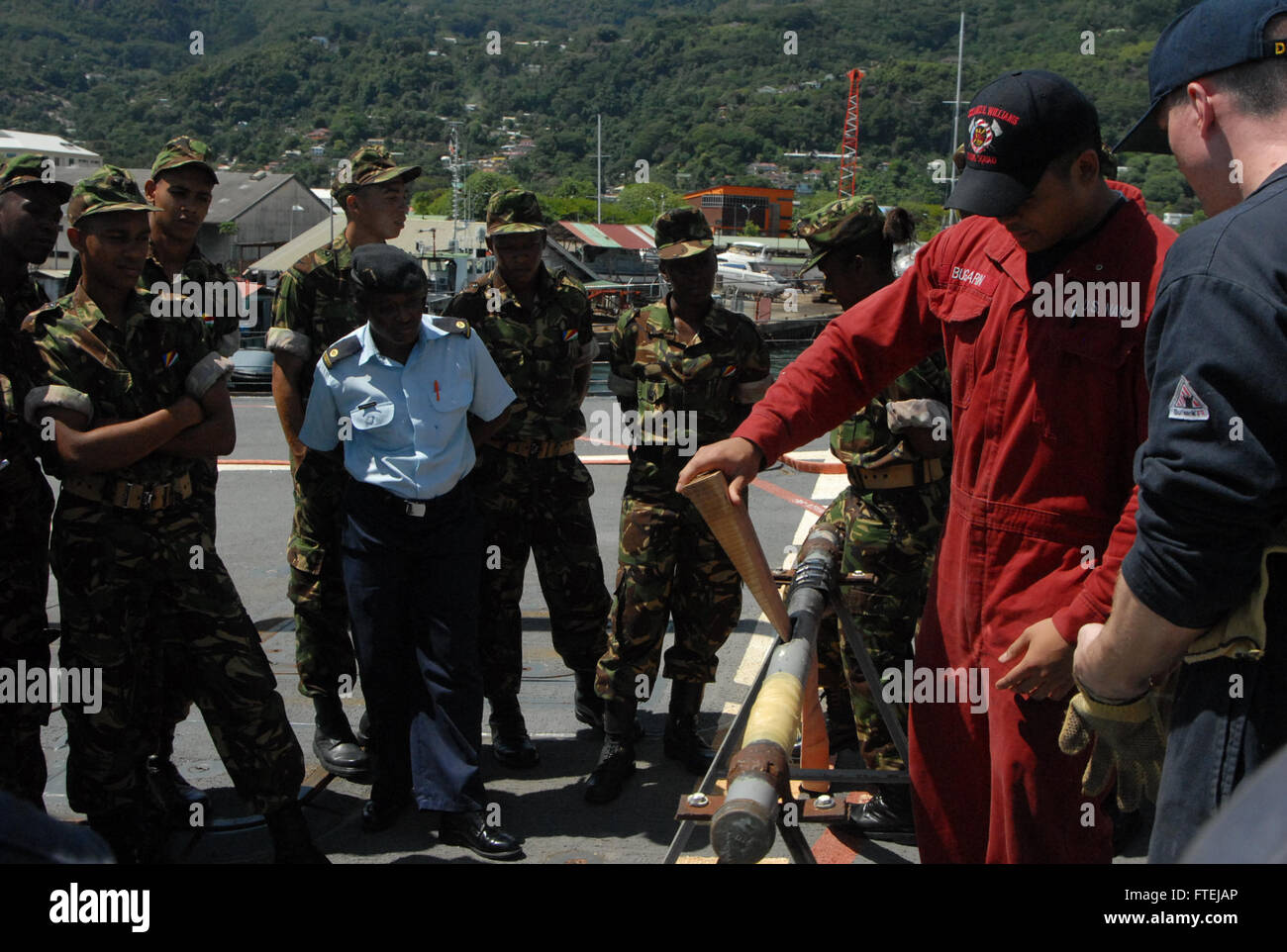 The image shows U.S. Navy Damage Controlman Fireman Christopher Bugarin ...