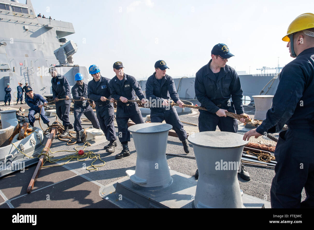 On December 31, 2014, sailors aboard the USS New York (LPD 21) perform ...
