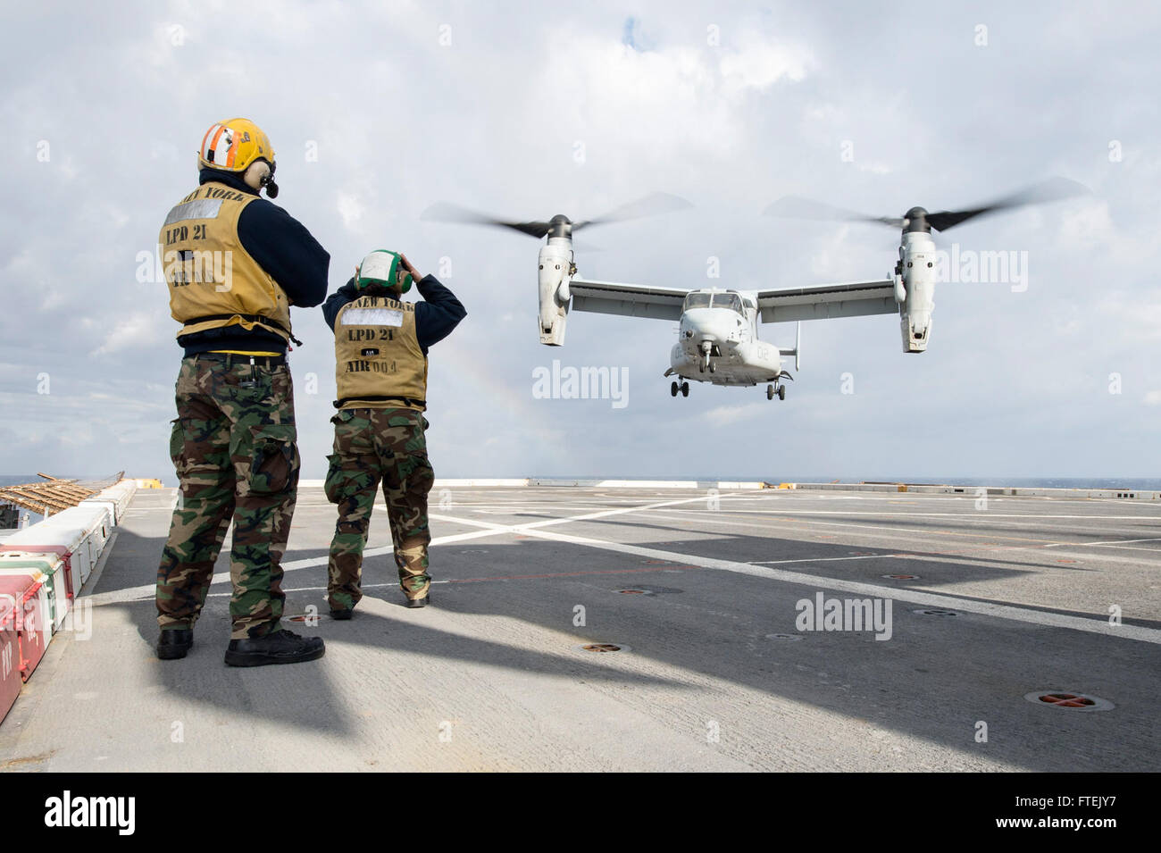 Aviation Support Equipment Technician Dylan Spake directs the landing ...