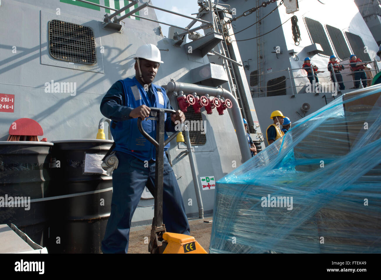 Senior Chief Culinary Specialist Stephen Wilson loads a pallet during a ...