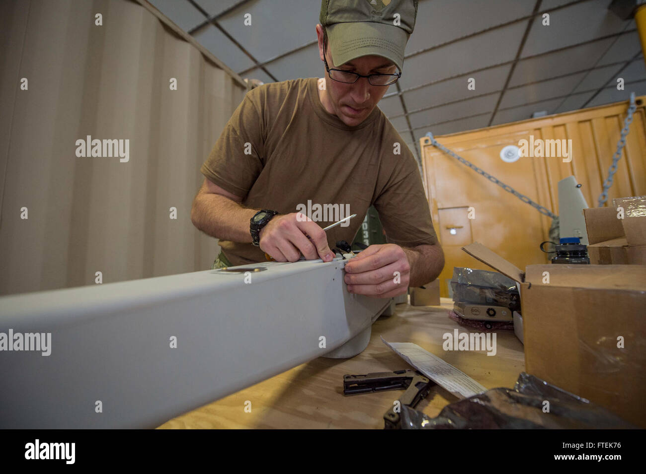 Intelligence Specialist 2nd Class Joshua Lesperance performs ...
