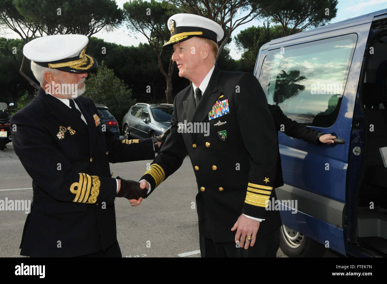The image captures a formal meeting between Spanish Admiral Santiago Bolibar Pi,eiro and Vice ...