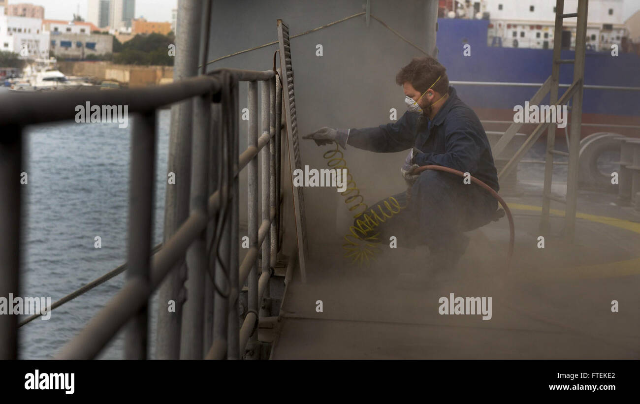 This image shows a civil service mariner performing maintenance on the ...