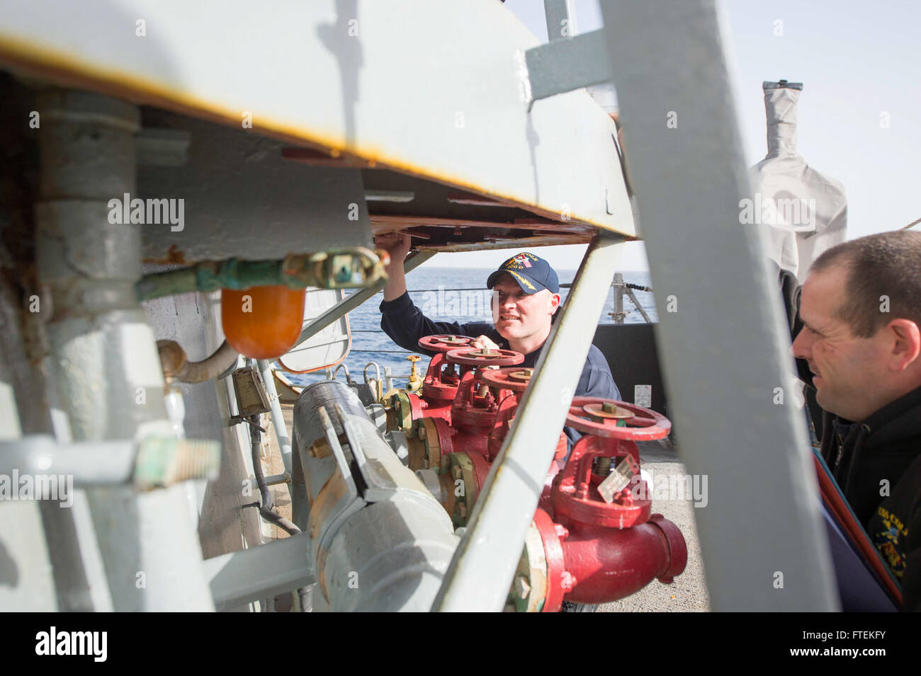 Cmdr. David Wroe, executive officer of USS Cole (DDG 67), inspects ...