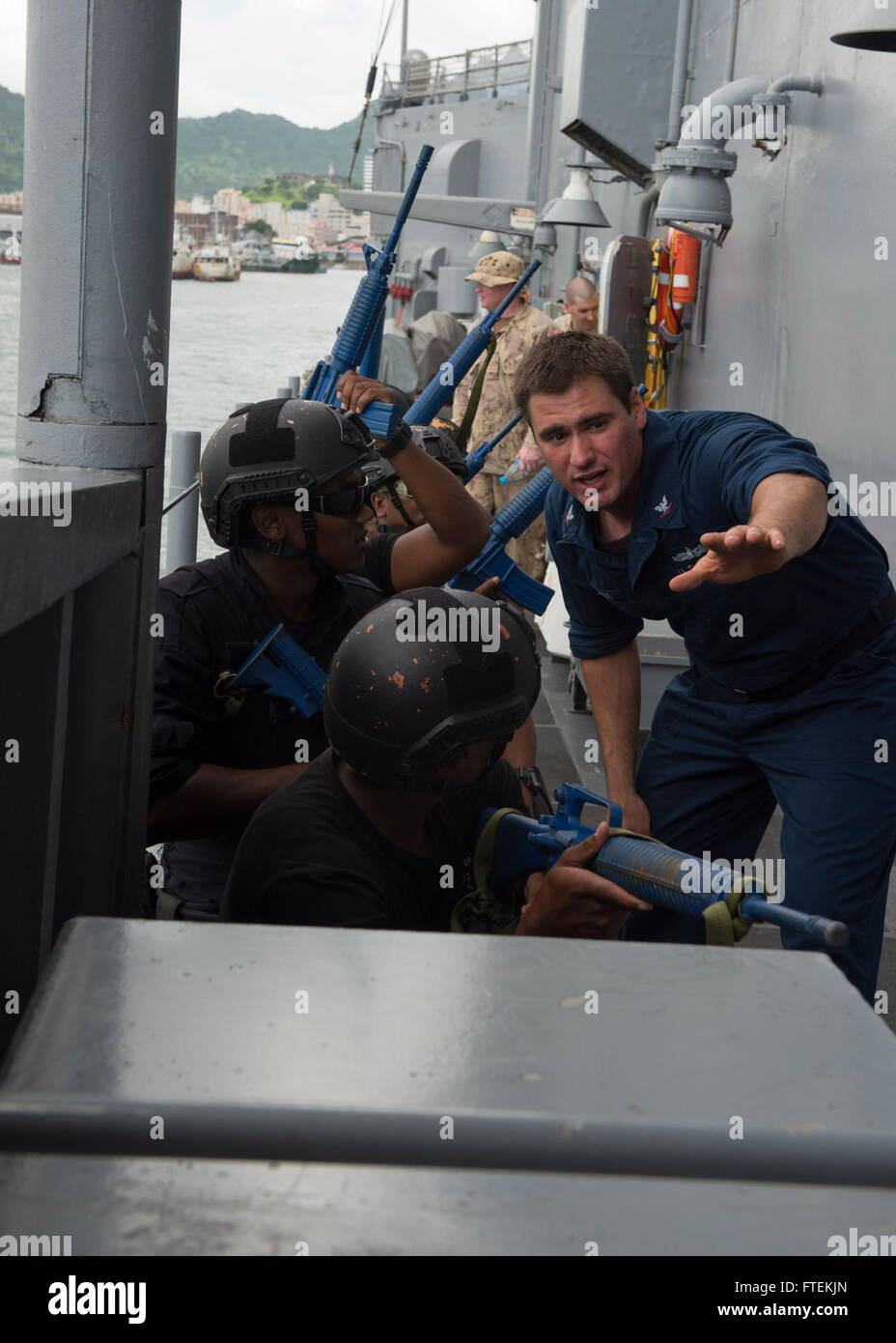 Operations Specialist 3rd Class Brian Darby instructs Mauritian ...