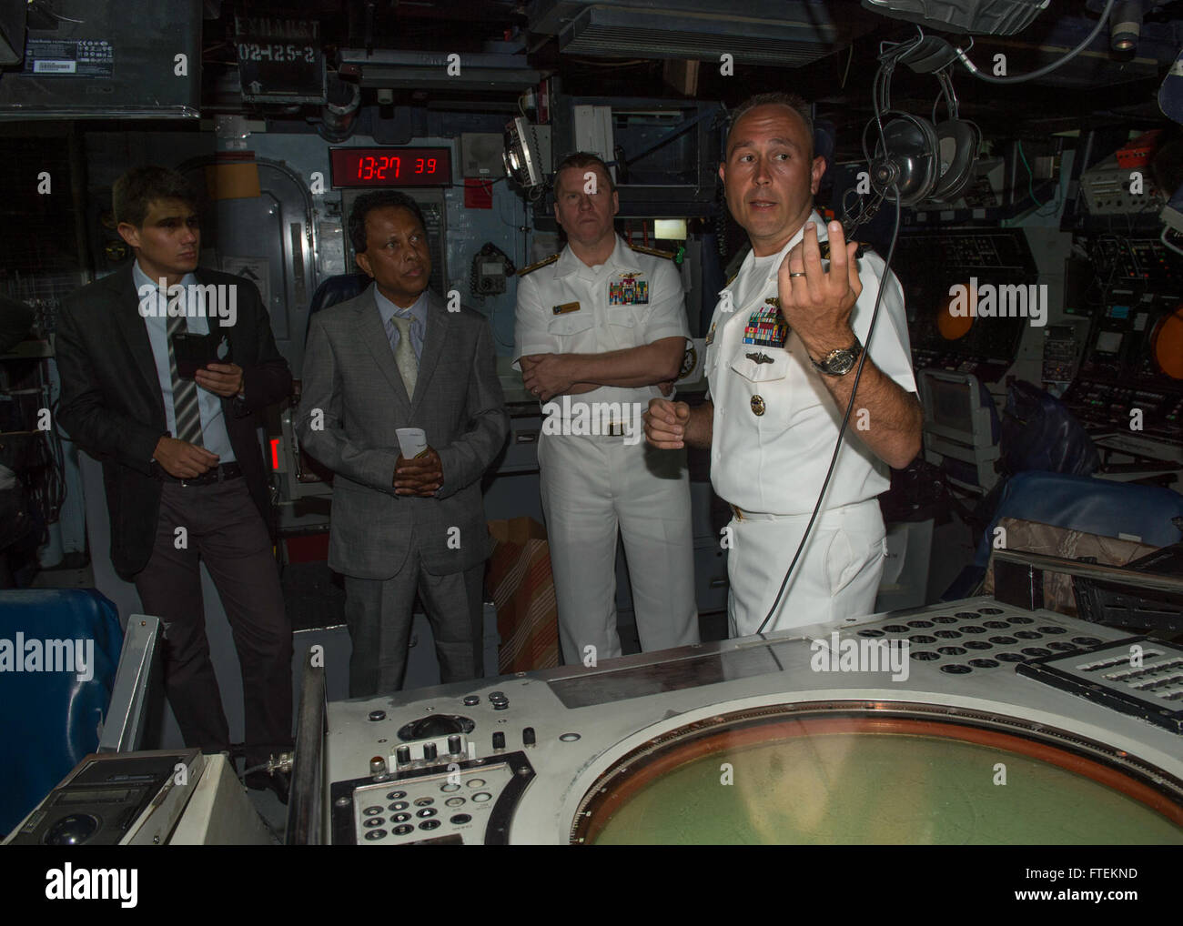 Cmdr. Ken Anderson of the USS Simpson (FFG 56) provides a tour of the ...