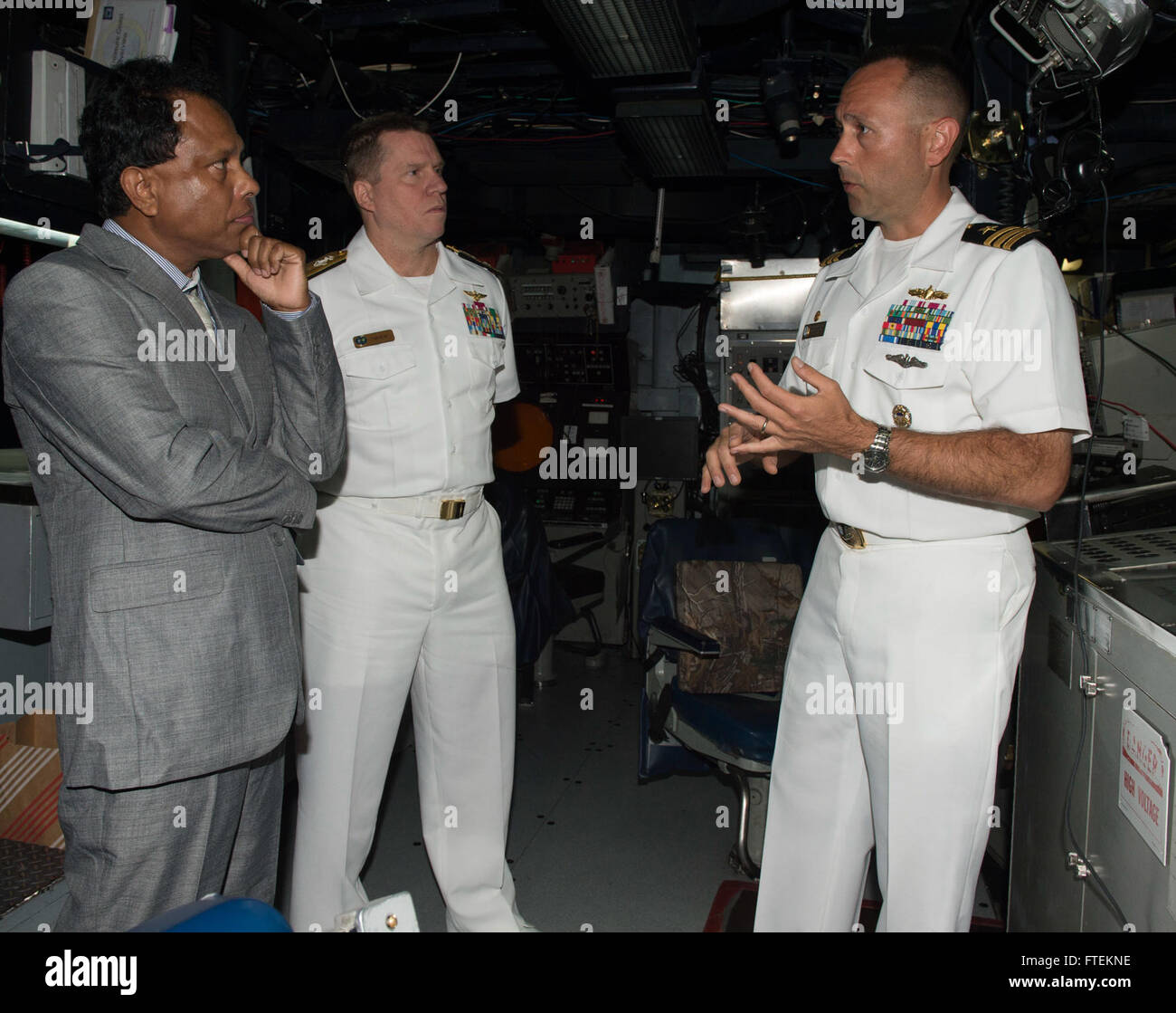 Cmdr. Ken Anderson of the USS Simpson (FFG 56) guided Mario Ayelou, the ...