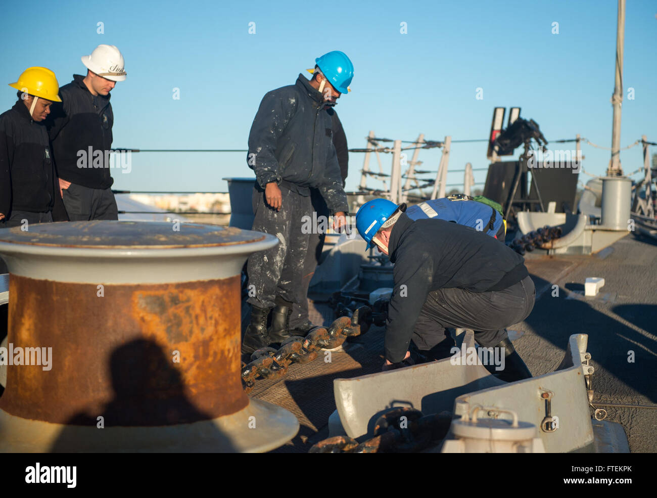 Sailors aboard USS *Donald Cook* (DDG 75) perform a sea-and-anchor ...