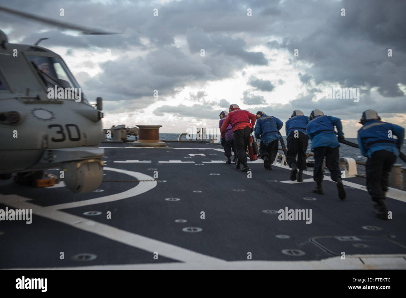 This U.S. Navy photo shows a hot refueling operation aboard the USS ...