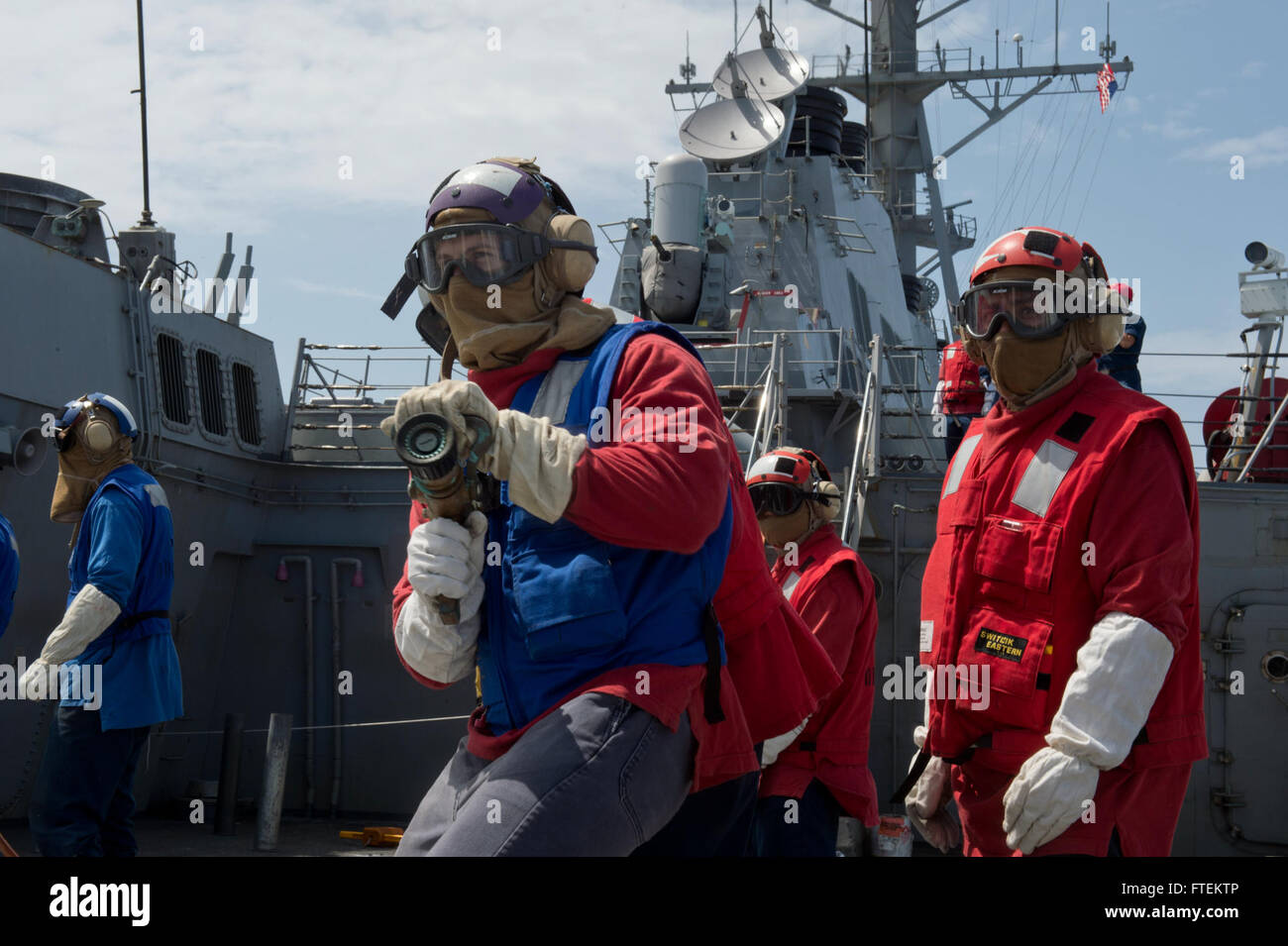 A photograph of the USS Mahan (DDG 72), an Arleigh Burke-class guided ...
