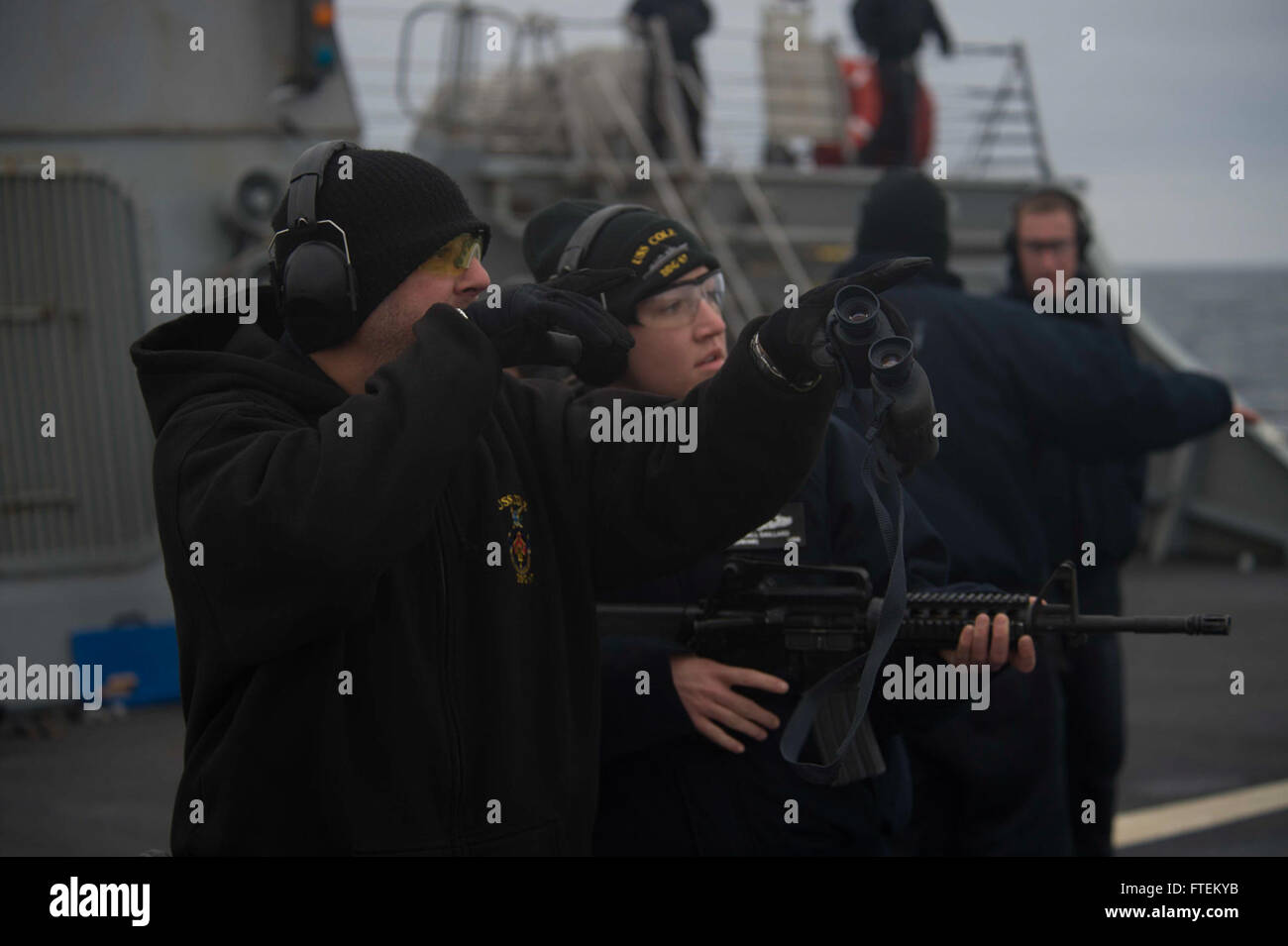 This image shows Fire Controlman 1st Class David Santino instructing ...