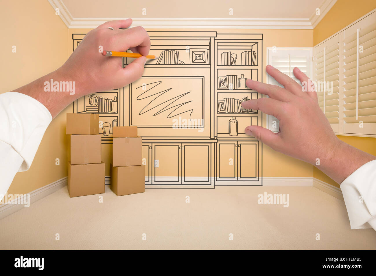 Hands Drawing Beautiful Entertainment Unit In Room With Moving Boxes ...