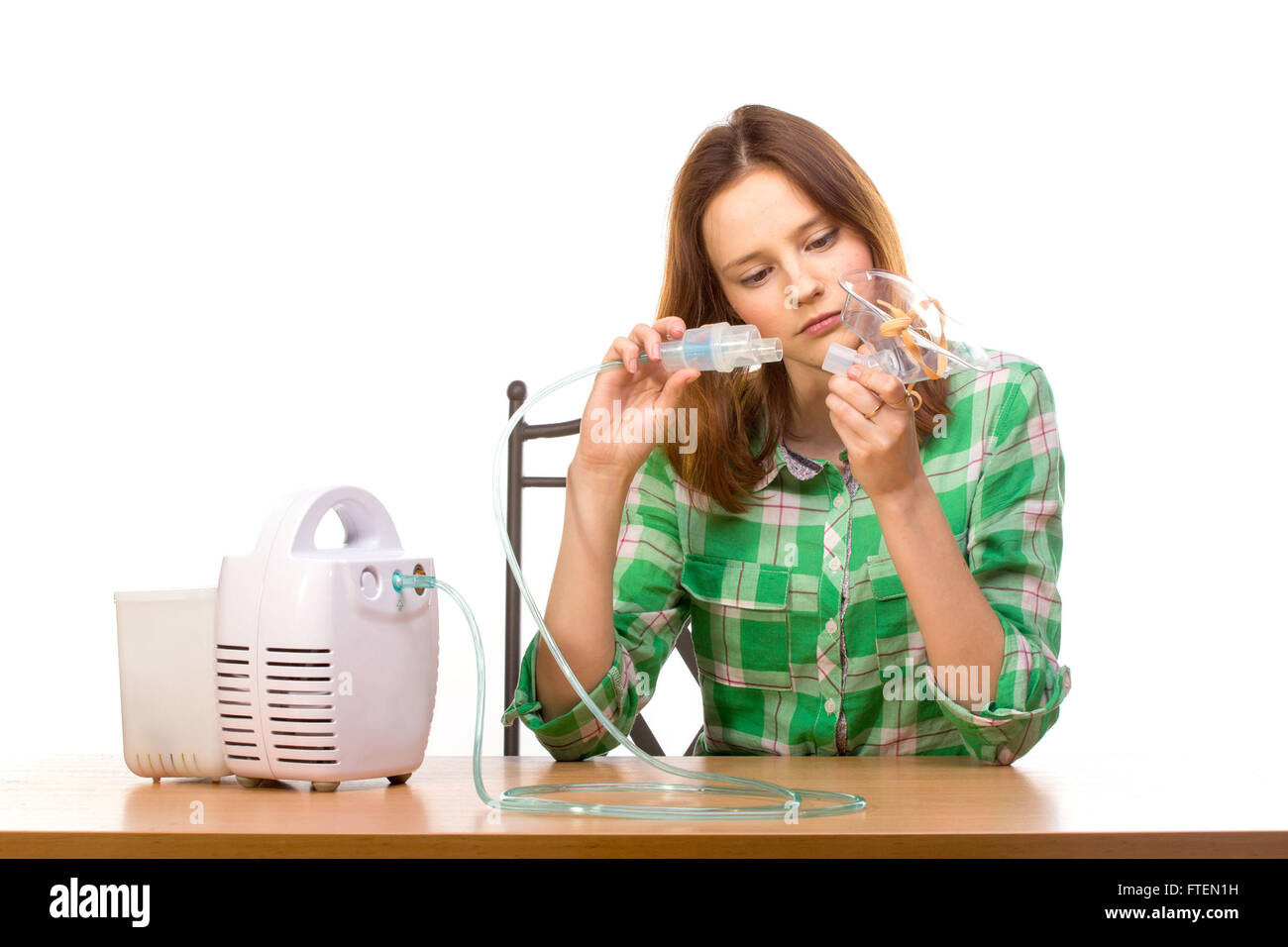 Young girl using nebulizer mask for respiratory inhaler Asthma ...