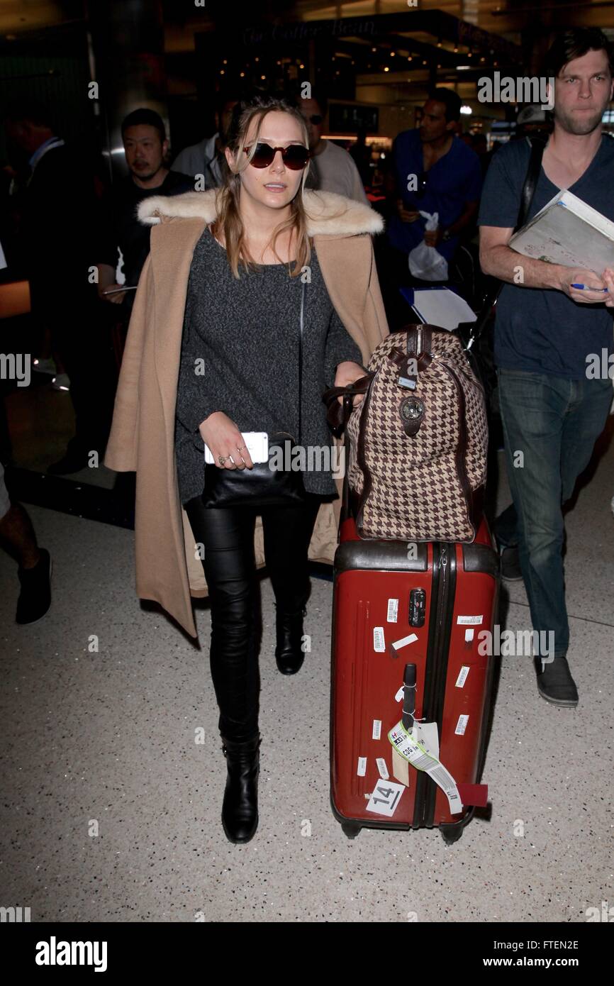 Elizabeth Olsen seen signing autographs as she arrives at LAX airport ...