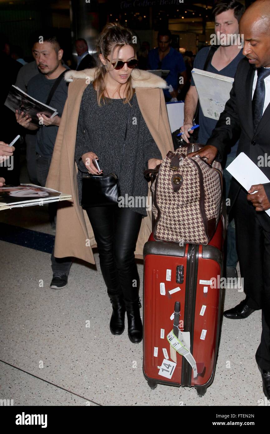 Elizabeth Olsen seen signing autographs as she arrives at LAX airport ...
