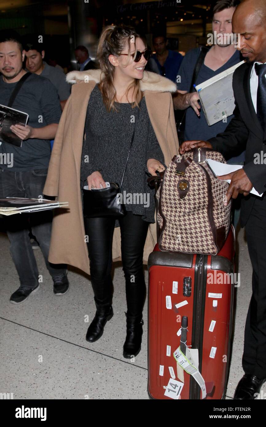 Elizabeth Olsen seen signing autographs as she arrives at LAX airport ...