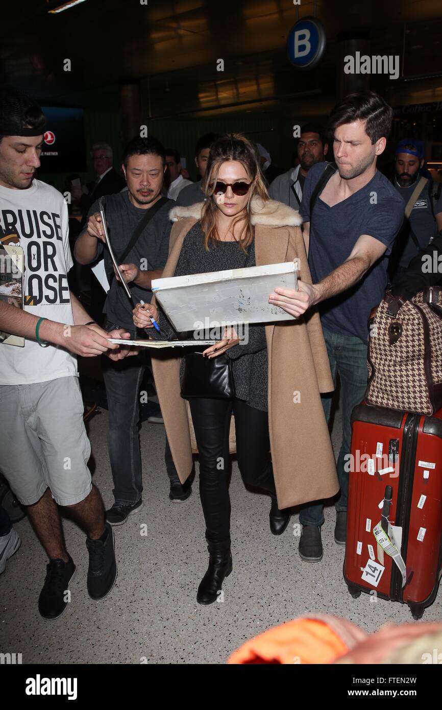 Elizabeth Olsen seen signing autographs as she arrives at LAX airport ...