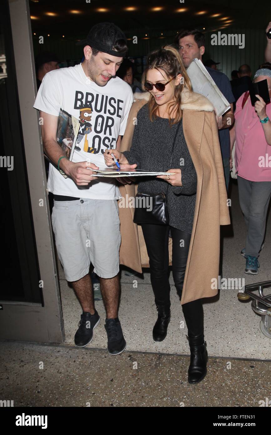 Elizabeth Olsen seen signing autographs as she arrives at LAX airport ...